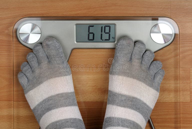 Feet on the scales stock photo. Image of body, human - 20394682