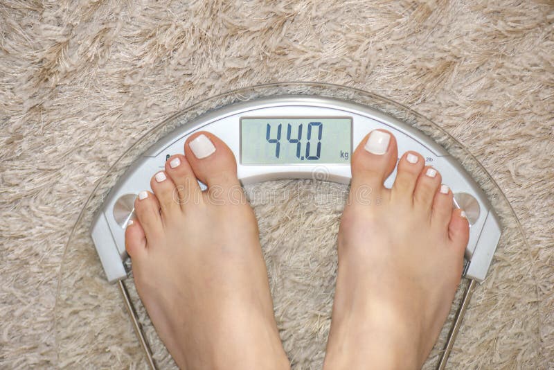 Feet on scales stock photo. Image of control, feet, balance - 65242672