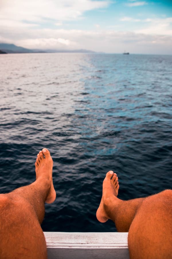 Feet with the Sea in the Background. Stock Image - Image of capital ...