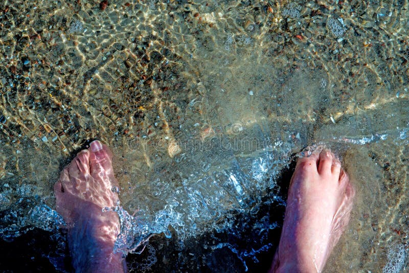 Feet in the sea stock image. Image of ocean, bath, beach - 150129881