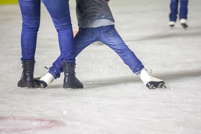 Feet on the Skates of a Person Rolling on the Ice Rink Stock Image ...
