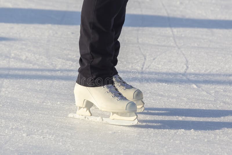 Feet on the Skates of a Person Rolling on the Ice Rink Stock Photo ...