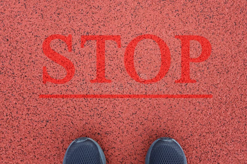 Feet Stand in Front of the Inscription Stop Stock Image - Image of road ...