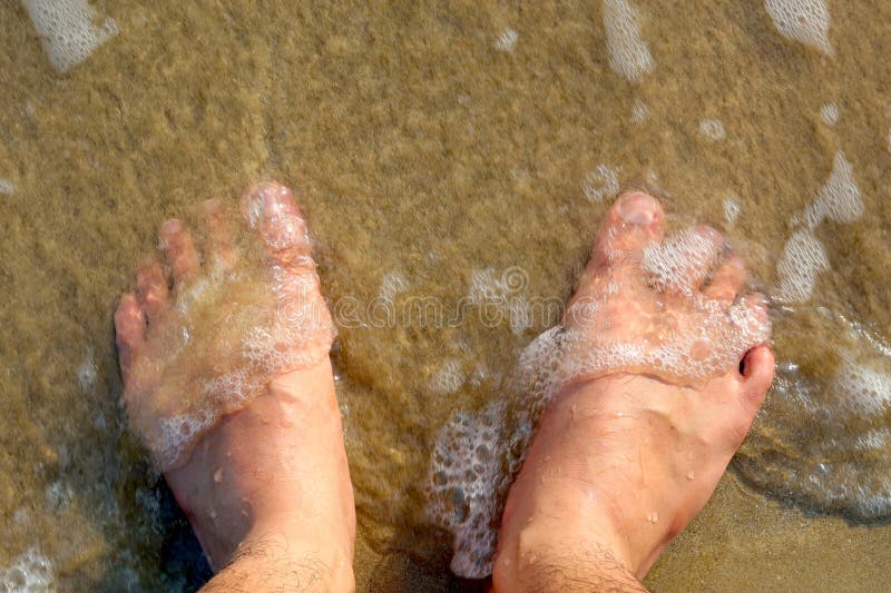 Feet step on the beach stock image. Image of female - 272821355