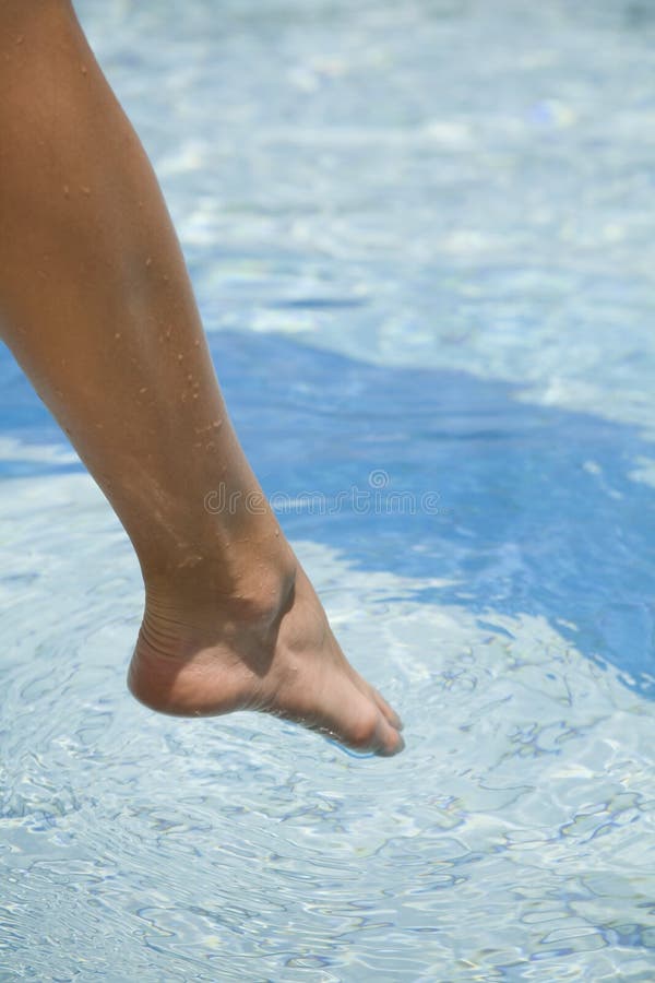 Feet Step Into The Swimming Pool Picture. Image: 5880548
