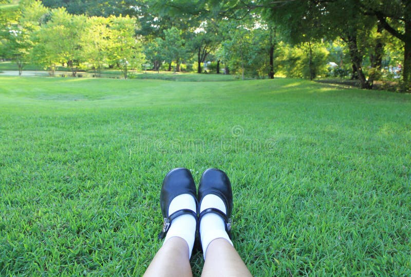 Feet in Student Shoes on Green Field Stock Photo - Image of outdoors ...