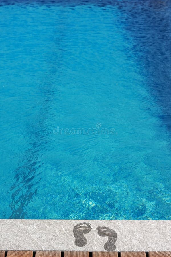 Feet by the swimming pool stock image. Image of ripple - 6402585