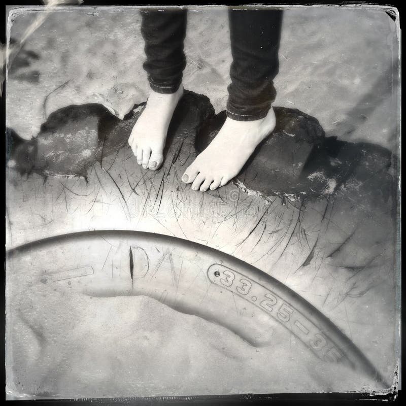 Feet on tyre stock photo. Image of female, close, feet - 30569220