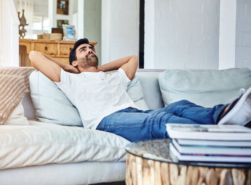 Feet Up, Wind Down. a Man Relaxing on the Sofa at Home. Stock Image ...