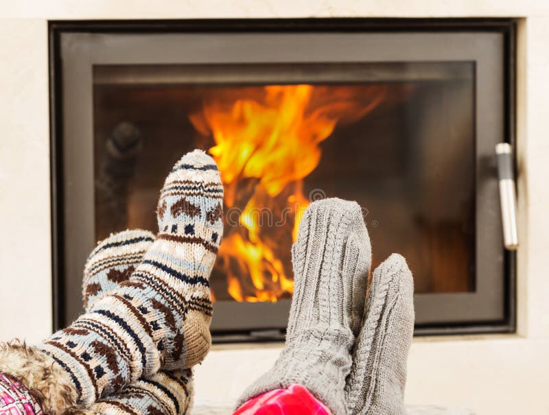 Feet warming by fireplace stock image. Image of fireplace - 52025347