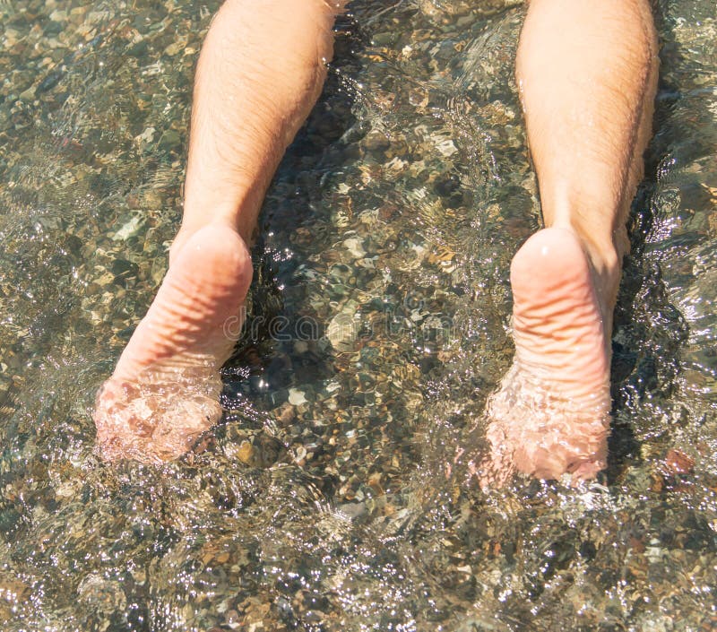 Male feet in the water stock image. Image of clean, male - 171282283
