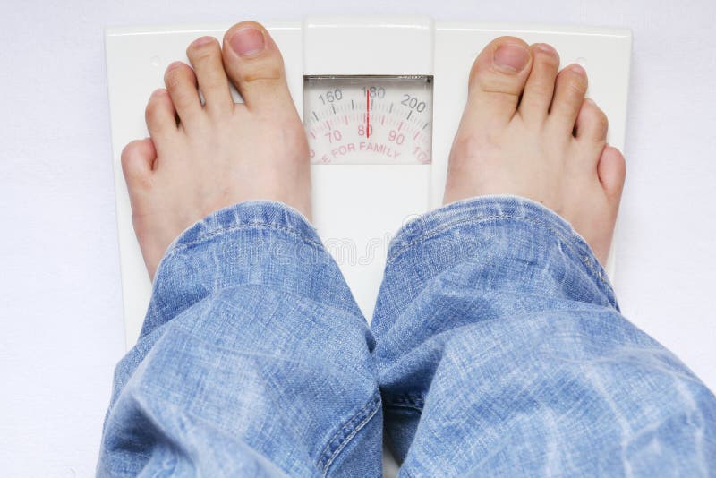 Woman stepping on scale stock photo. Image of step, feet - 4743750