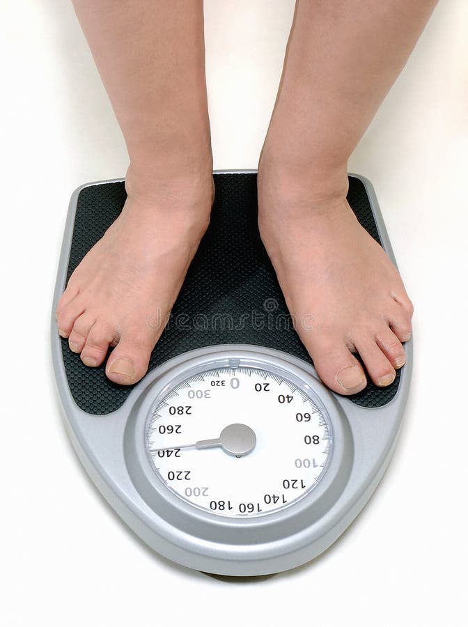 Feet on Weight Scale stock image. Image of wellbeing - 94825375