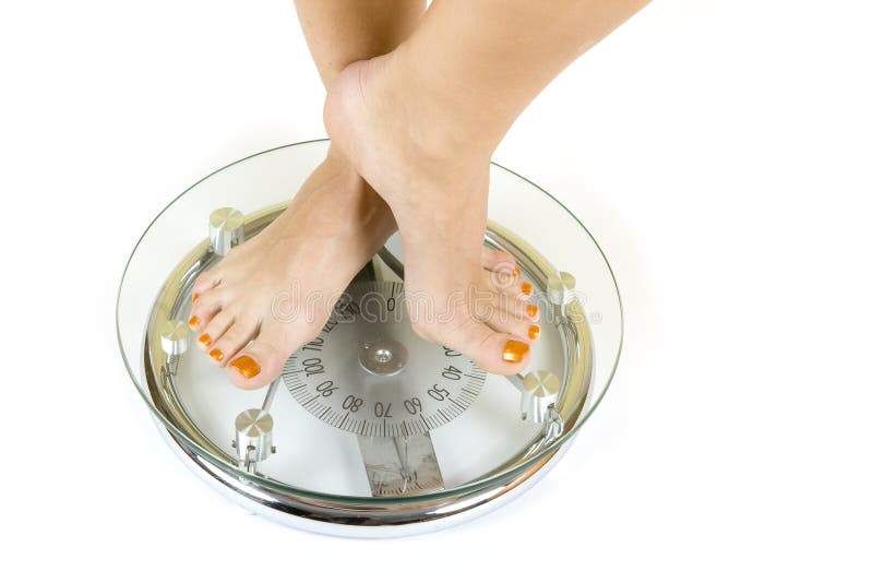Feet on white glass scale stock image. Image of glass - 4027901