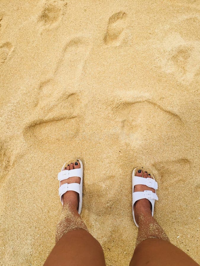 Feet with a White Slippers in a White Sand Beach Stock Photo - Image of ...