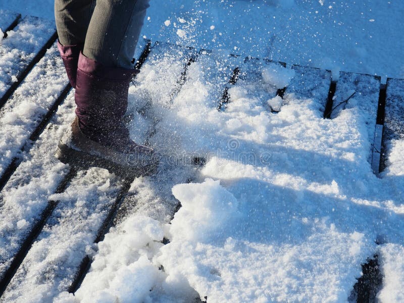 The Feet in the Winter Boots Kick the Snow Stock Image - Image of ...