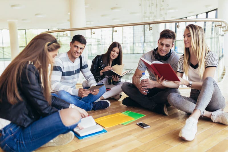 Students Sitting on Floor in Campus and Preparing Together for Exams ...