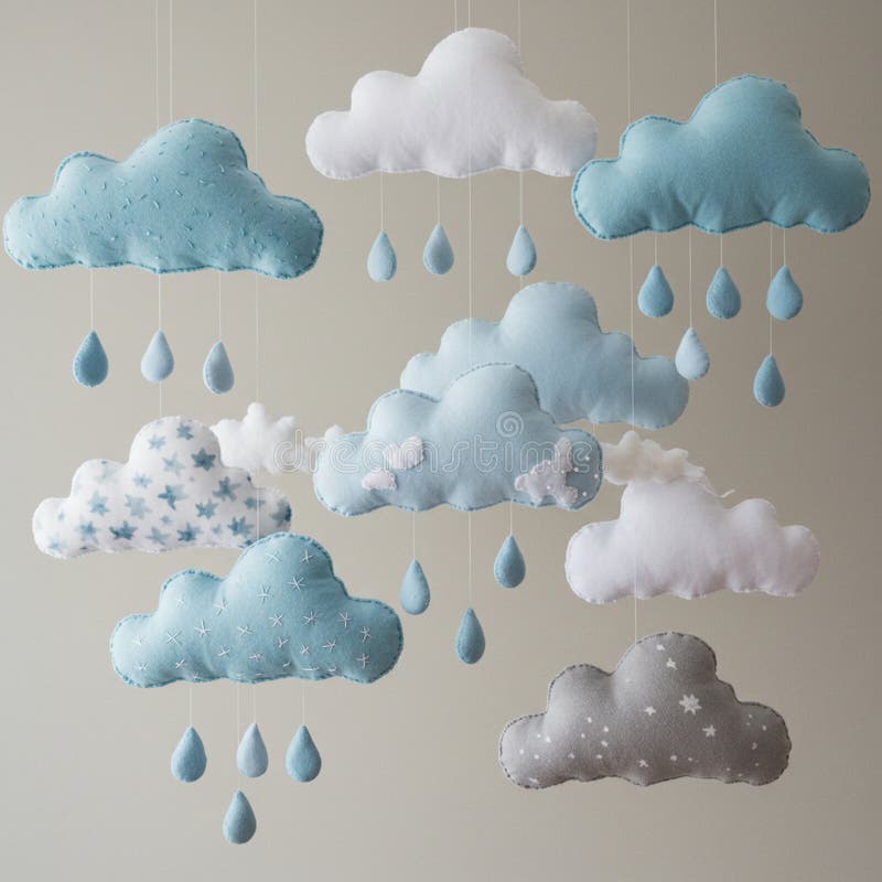 Felt Cloud Mobile Features Soft Clouds in Shades of Blue, White, and ...