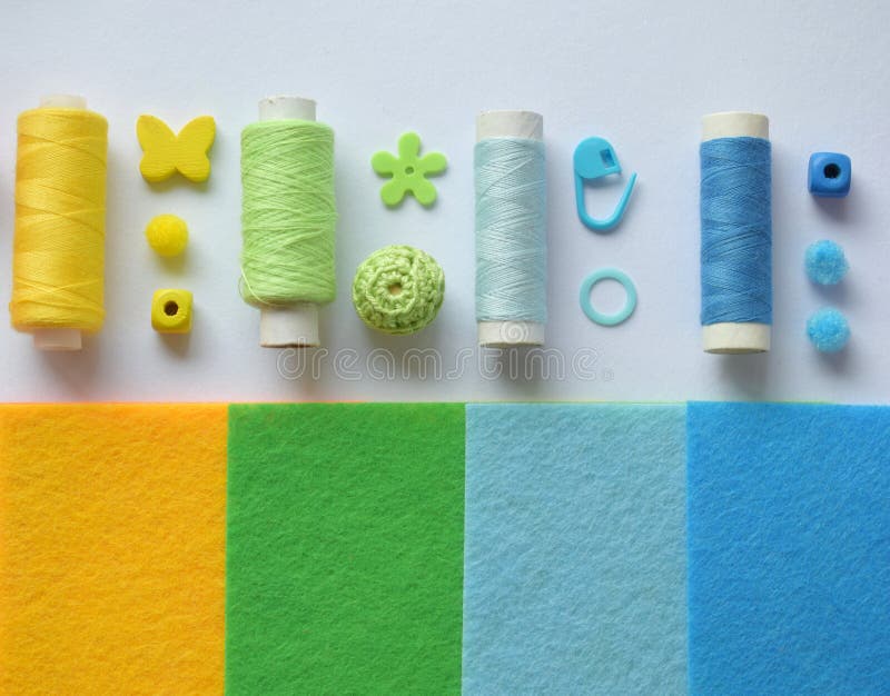 Felt Rectangles in Yellow, Green, Blue Serve As Background for Neatly ...