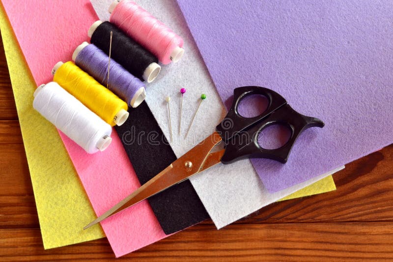 Felt Sheets, Scissors, Thread, Needle, Pins on a Brown Wooden ...