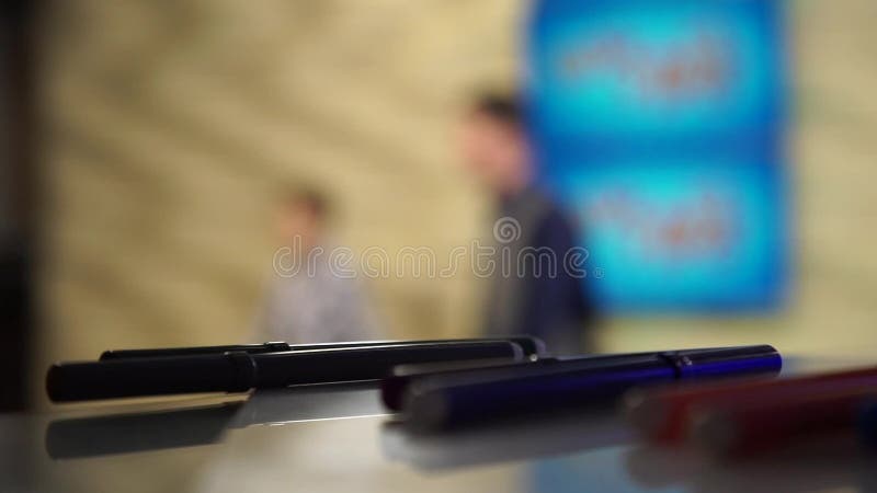 Pens Falling and Landing in Glass on Office Desk Stock Footage - Video ...