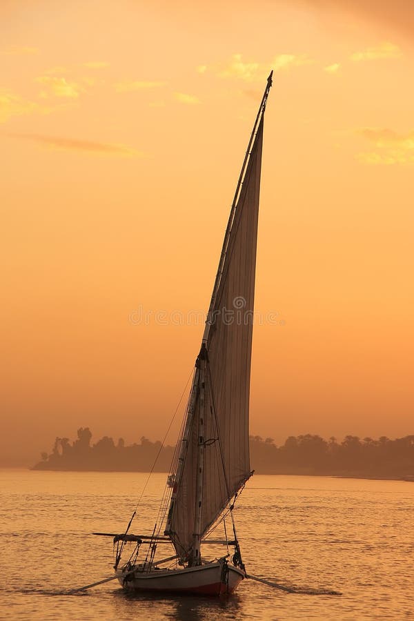 Felucca Boat Sailing on the Nile River at Sunset, Luxor Stock Photo ...