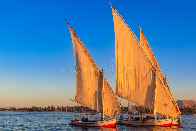 Felucca Boats Sailing On The Nile River In Luxor Egypt Traditional