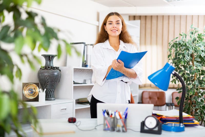 Female Accountant Holding Standing beside Desk Stock Photo - Image of ...