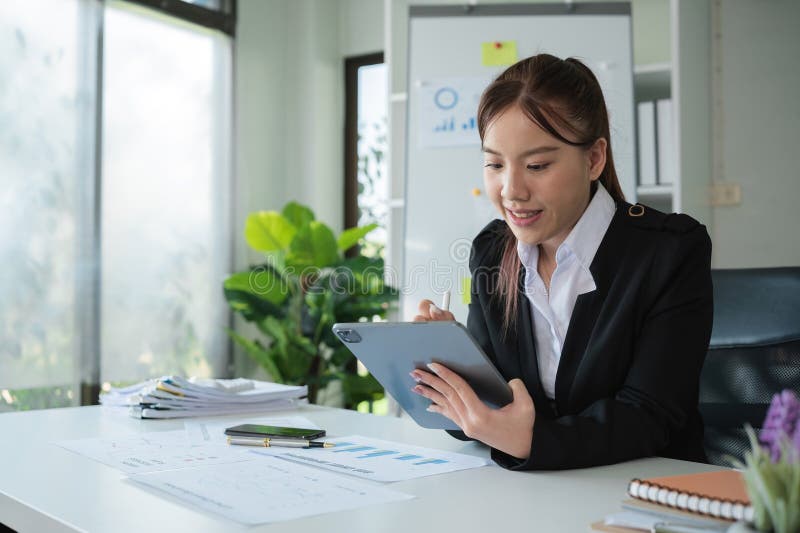 Professional Female Accountant Working in Modern Office with Tablet and ...