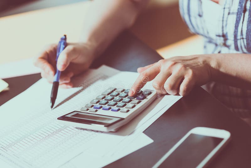 Female Accountant Using Calculator Stock Photo - Image of accounting ...