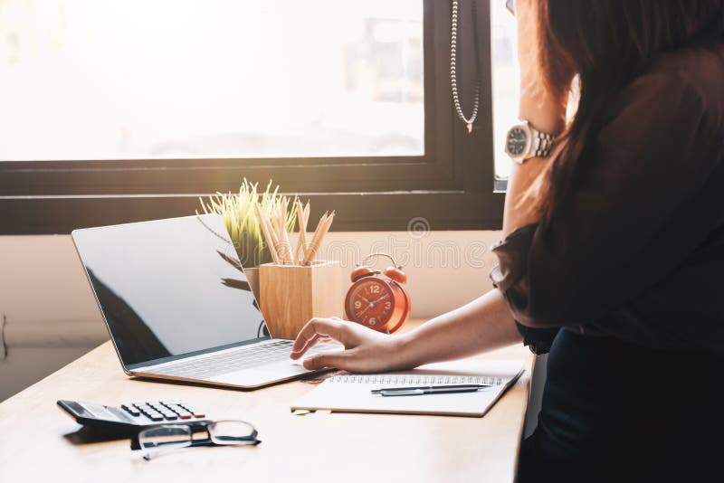 Female Accountant Using Calculator and Typing on Laptop. Stock Image ... Female Accountant Using Calculator and Typing on Laptop. Stock Image ...