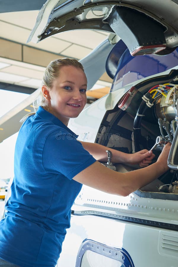 Portrait of Female Aero Engineer Working on Helicopter in Hangar Stock ...