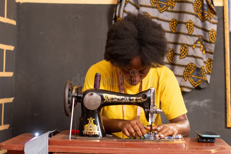 Female African Tailor Sewing with Her Machine Stock Image - Image of ...