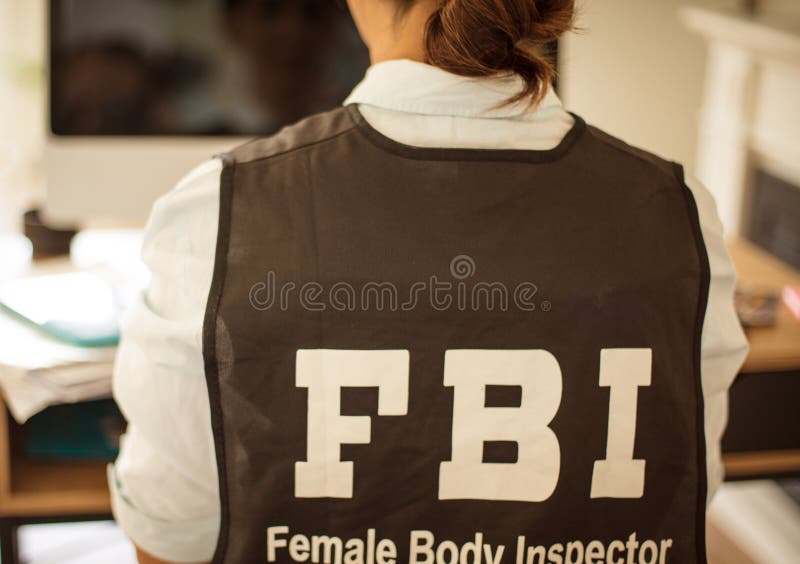 FBI Female Working Agent in Her Office. Focus is on Foreground Female ...