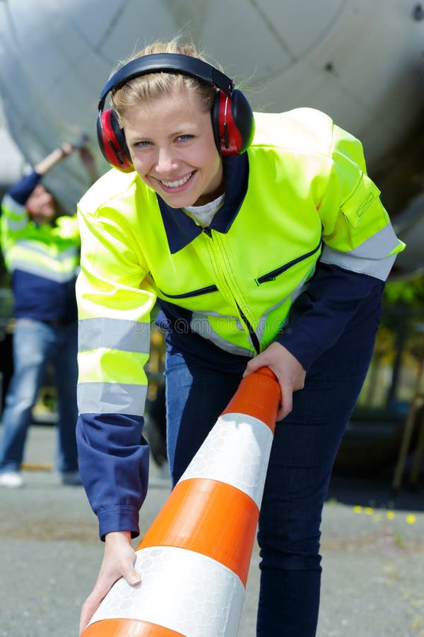 Female Airport Ground Worker Smiling Stock Image - Image of staff ...