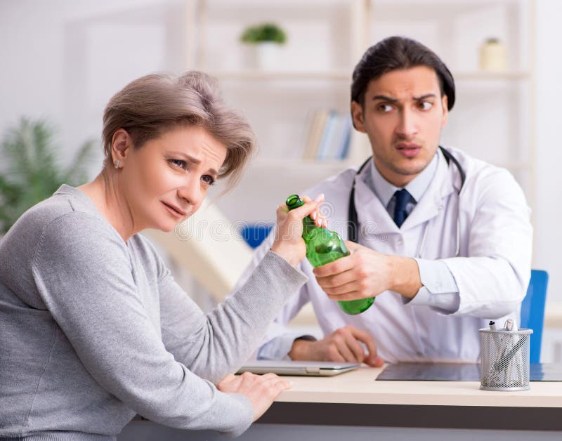 Female Alcoholic Visiting Young Male Doctor Stock Image - Image of ...