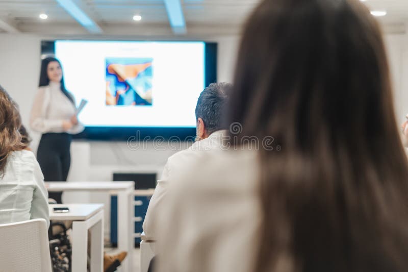 Female Analyst Holding a Speech To a Group of Economists. Presenting ...
