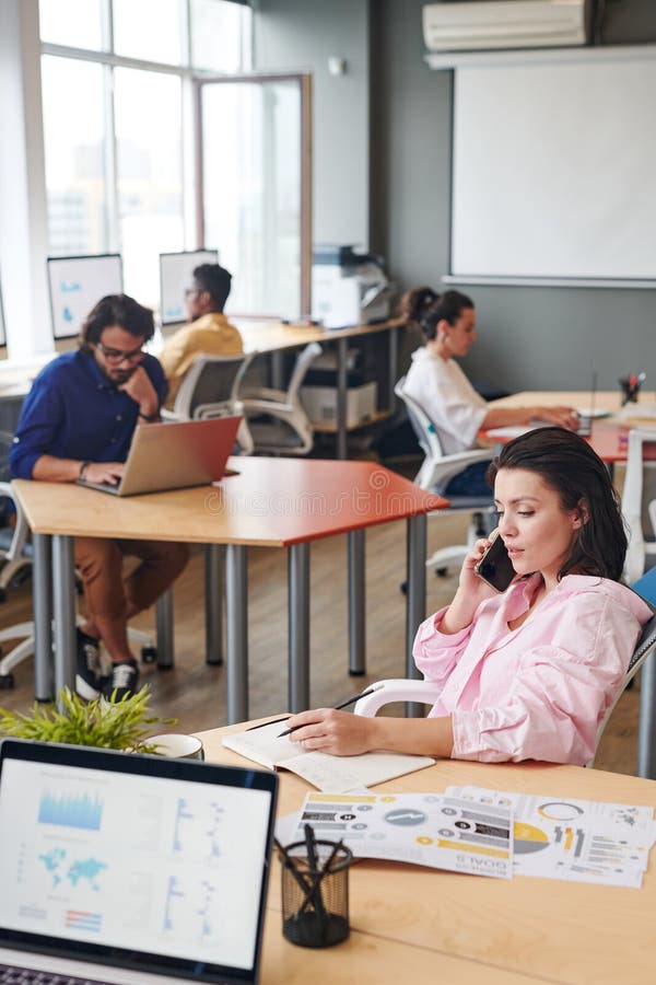 Female Analyst Talking To Client by Phone Stock Photo - Image of ...