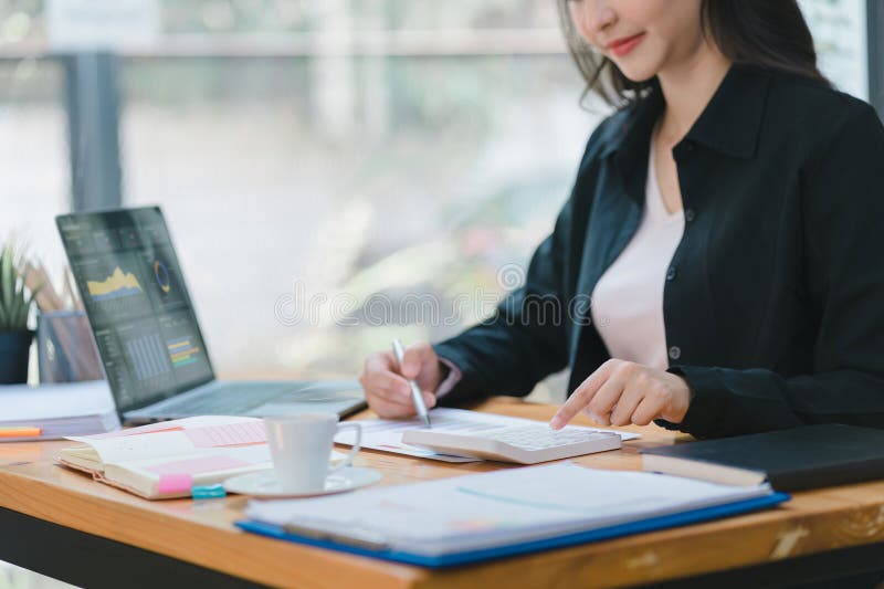 The Female Analyst Utilizes a Computer and a Dashboard for Business ...