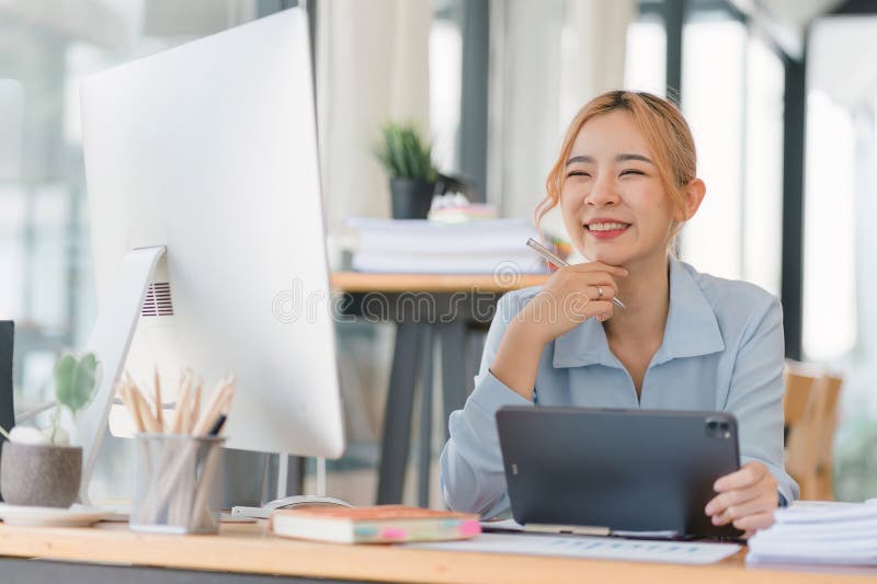 The Female Analyst Utilizes a Computer and a Dashboard for Business ...