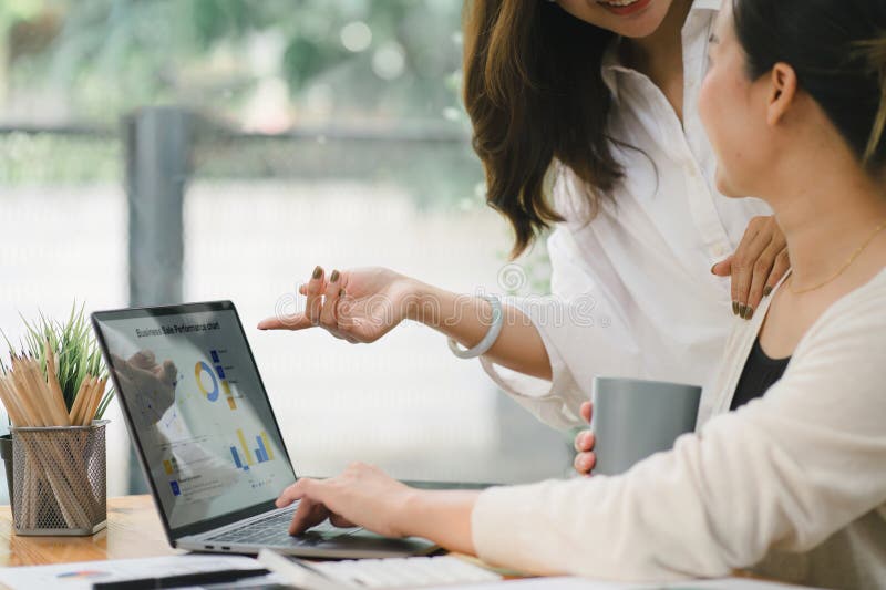 The Female Analyst Utilizes a Computer and a Dashboard for Business ...