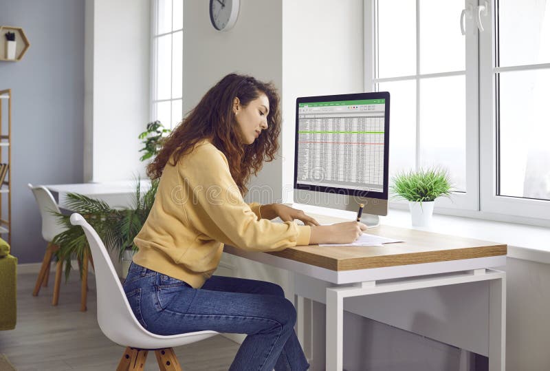 The Female Analyst Utilizes a Computer and a Dashboard for Business ...