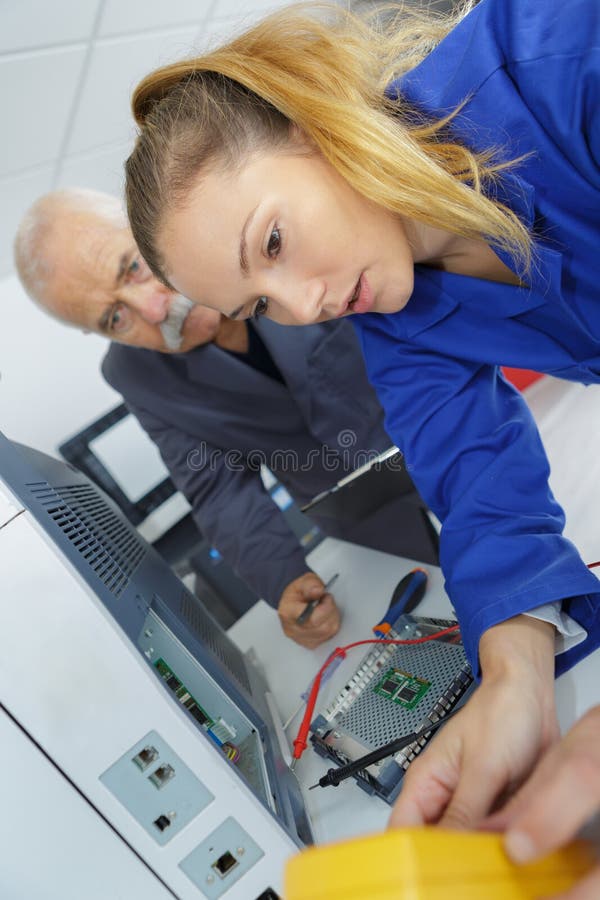 Female Apprentice and Computer Hardware Stock Photo - Image of ...