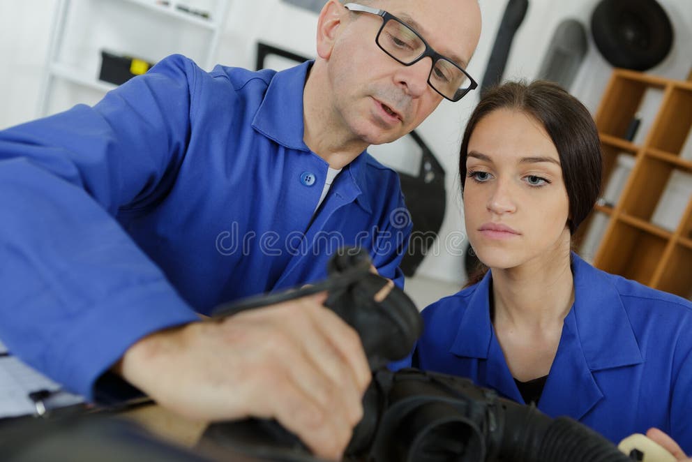 Female Apprentice Engineer with Teacher Stock Image - Image of ...