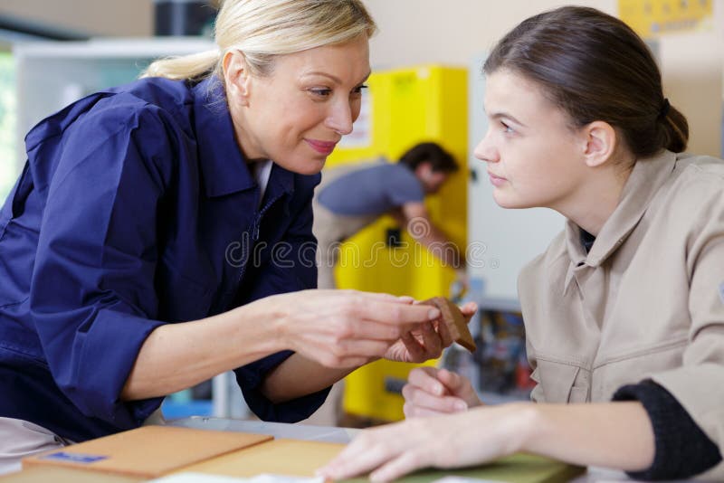 Female Apprentice Engineer Working with Female Manager Stock Photo ...