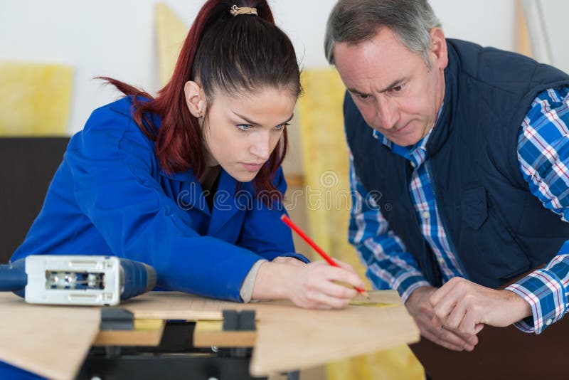 Female Apprentice with Pencil and Wood in Hands Stock Image - Image of ...