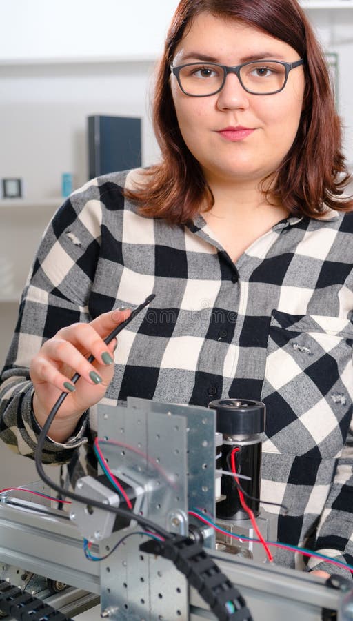 Female Apprentice Working on CNC Machinery. Stock Photo - Image of ...