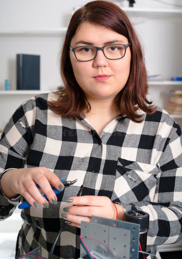 Female Apprentice Working on CNC Machinery. Stock Image - Image of ...