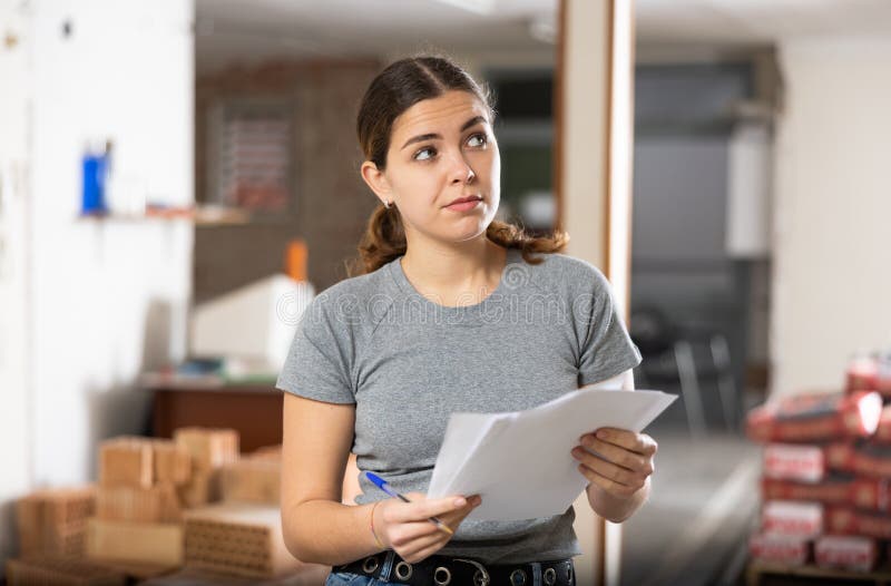 Female Architect Checking Documents in Construction Site Stock Image ...