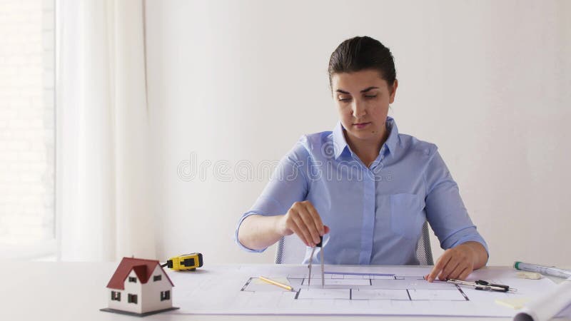 Female Architect with Compass Measuring Blueprint Stock Footage - Video ...